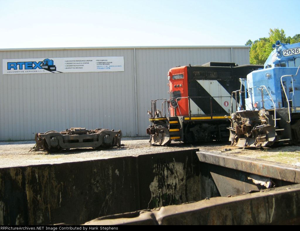 A shot through the fence sjowing the new RTEX signage and ex CN and CR units on Labor Day, 2010